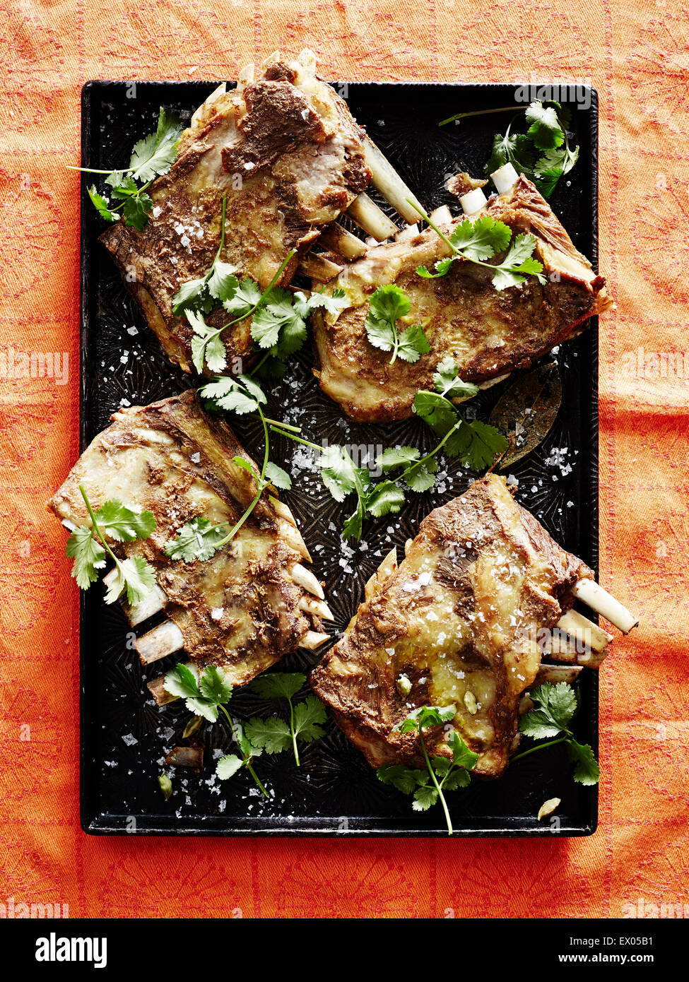 Roasting tin of Kashmiri tabak maaz (lamb ribs Stock Photo - Alamy