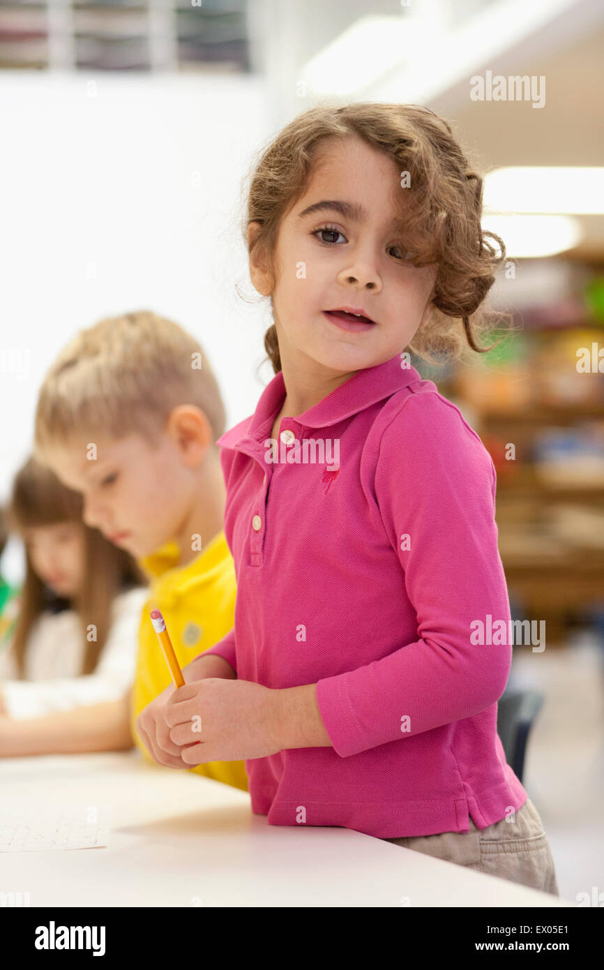 Girl hispanic desk writing pencil hi-res stock photography and images ...