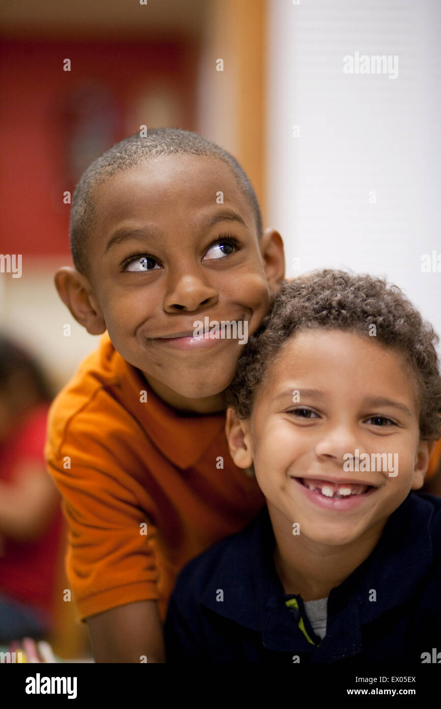 Boys smiling in classroom Stock Photo - Alamy