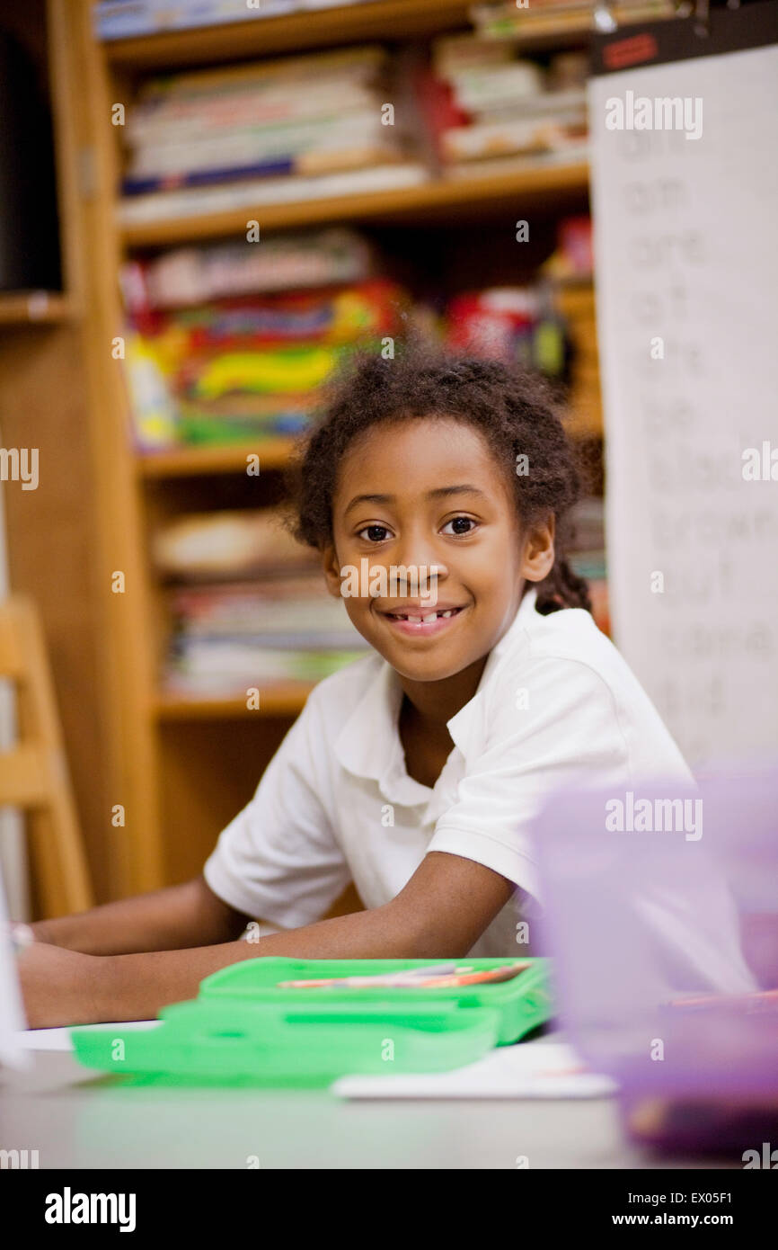 Girl smiling in classroom Stock Photo - Alamy