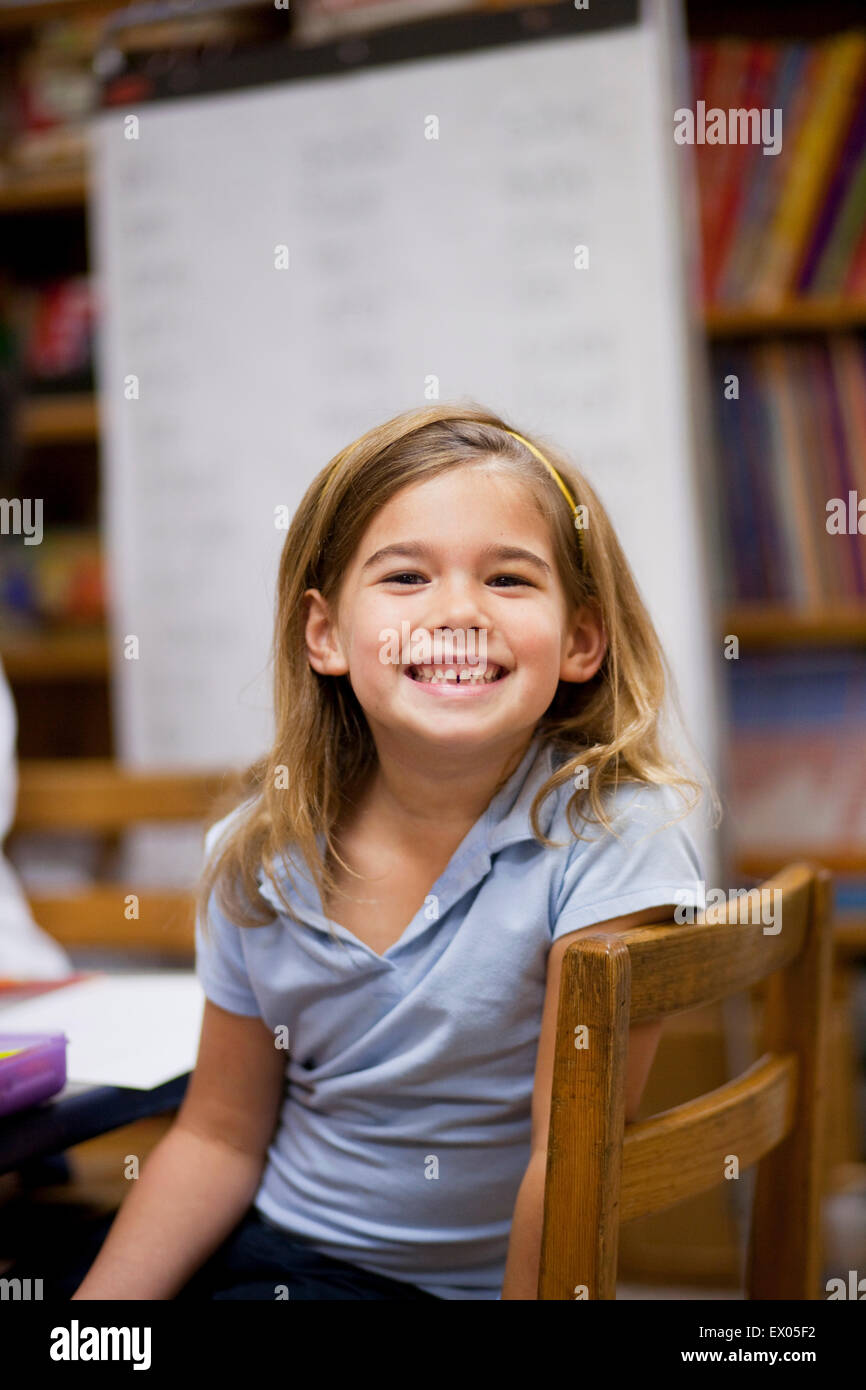 Girl smiling in classroom Stock Photo - Alamy