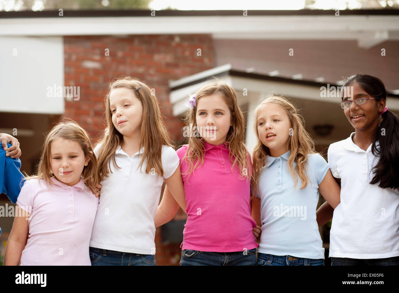 Children standing in a row outdoors Stock Photo - Alamy