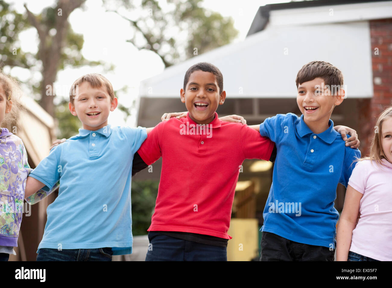 Children standing in a row outdoors Stock Photo - Alamy