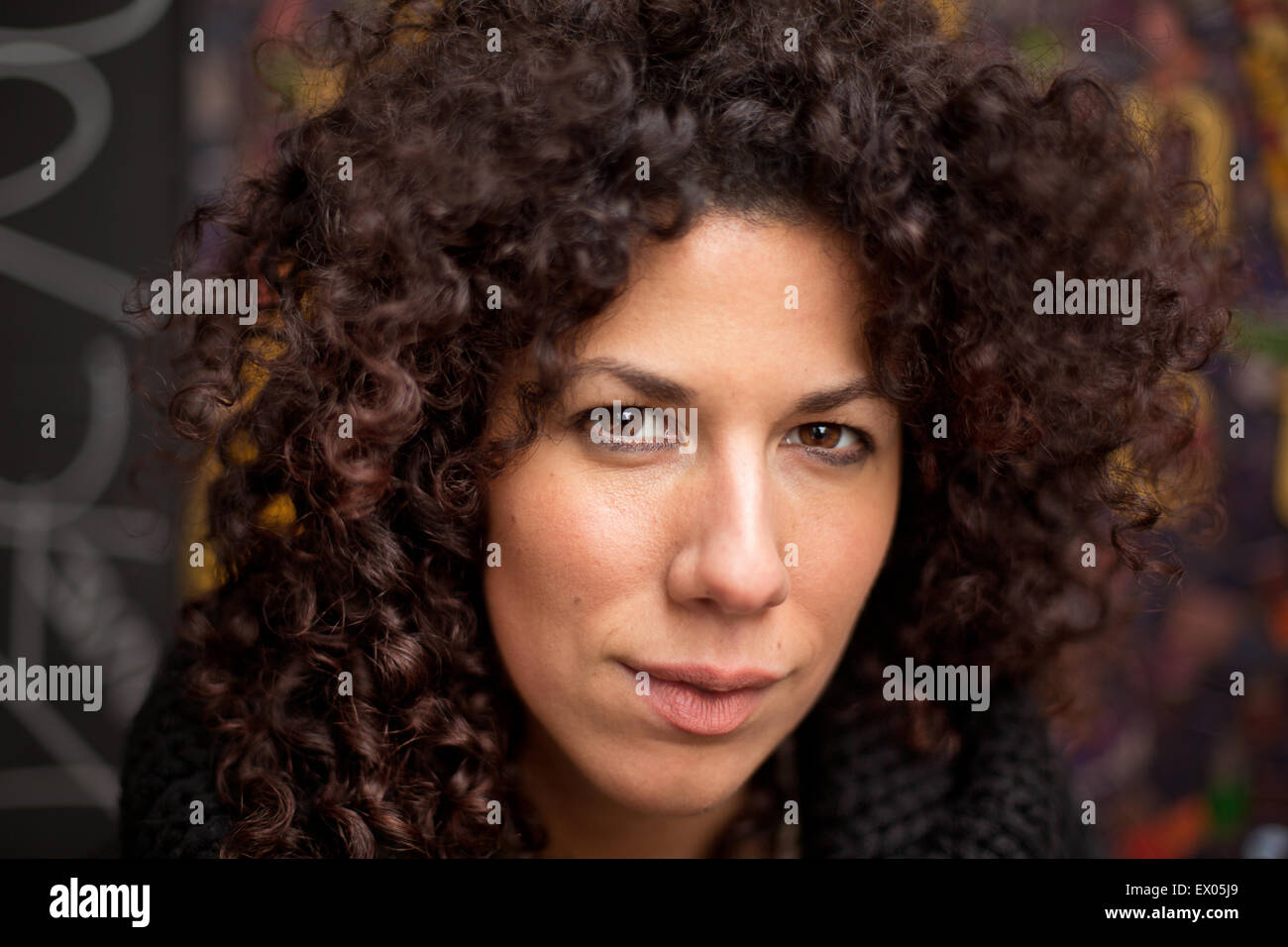 Women dark curly hair hi-res stock photography and images - Alamy