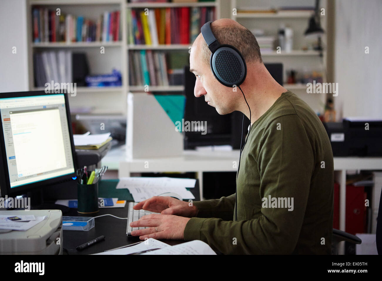 Man wearing headphones in computer hi-res stock photography and images ...