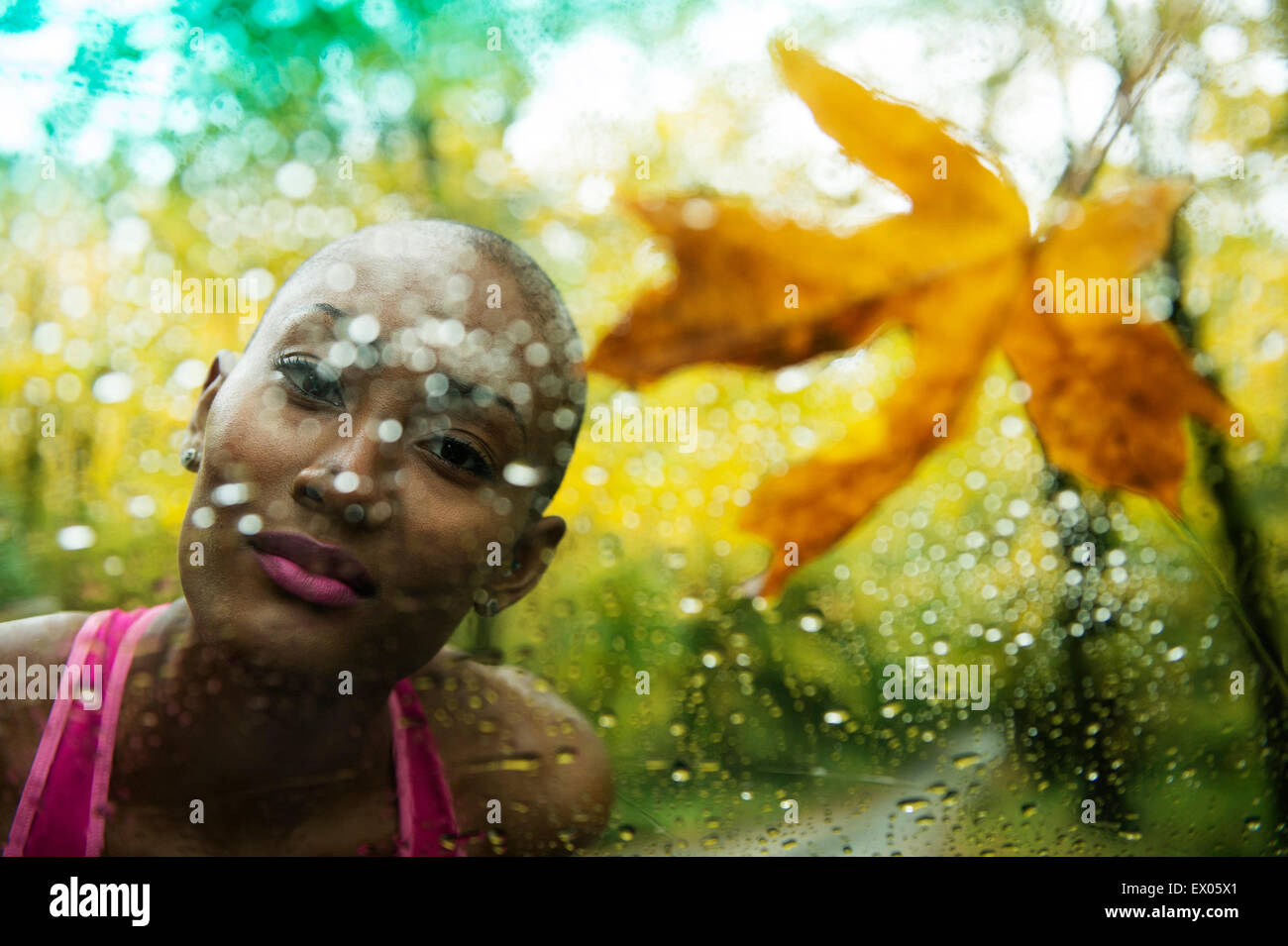 Woman looking through window rain hi-res stock photography and images ...