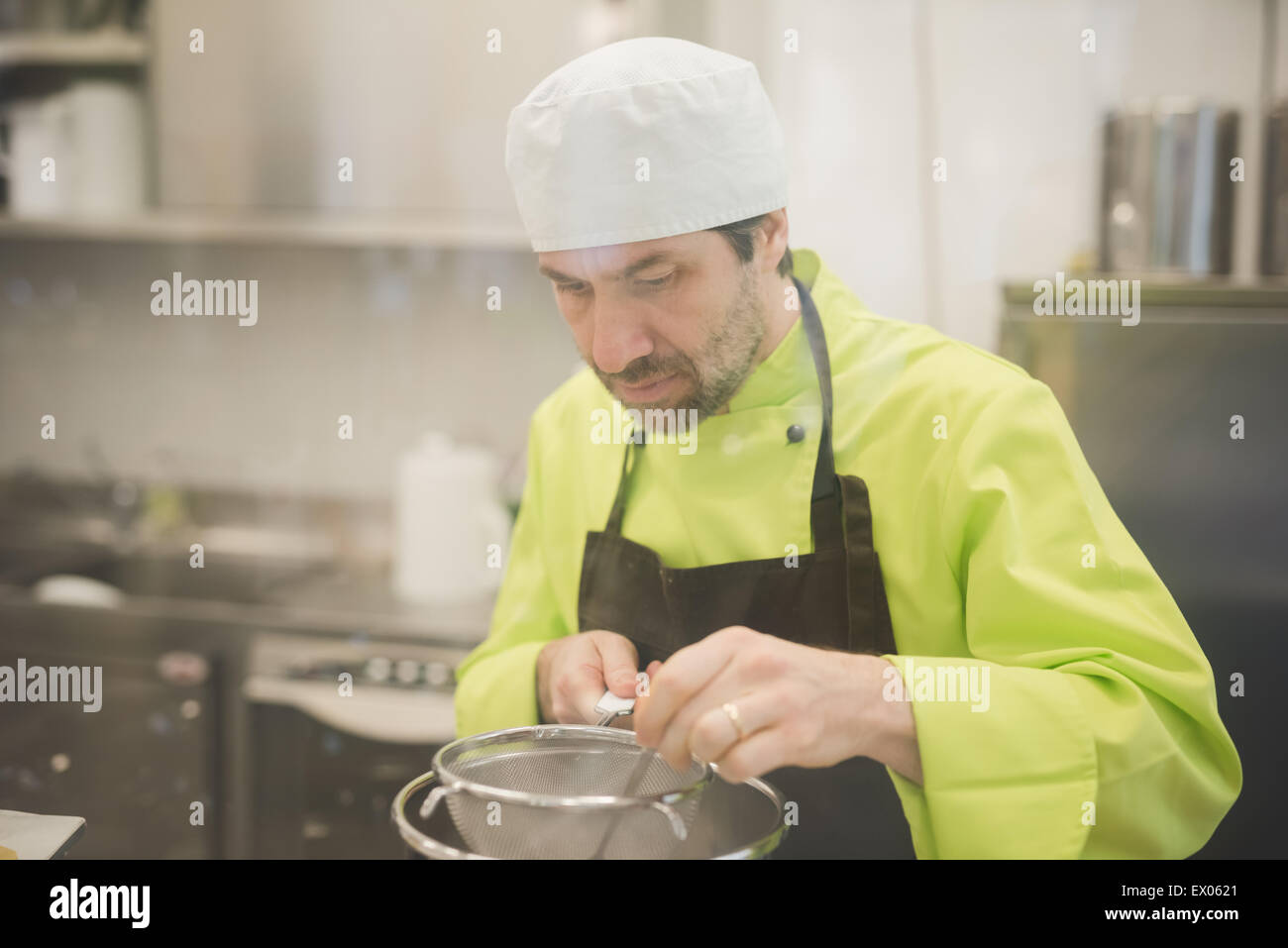 Baker cooking in kitchen Stock Photo - Alamy