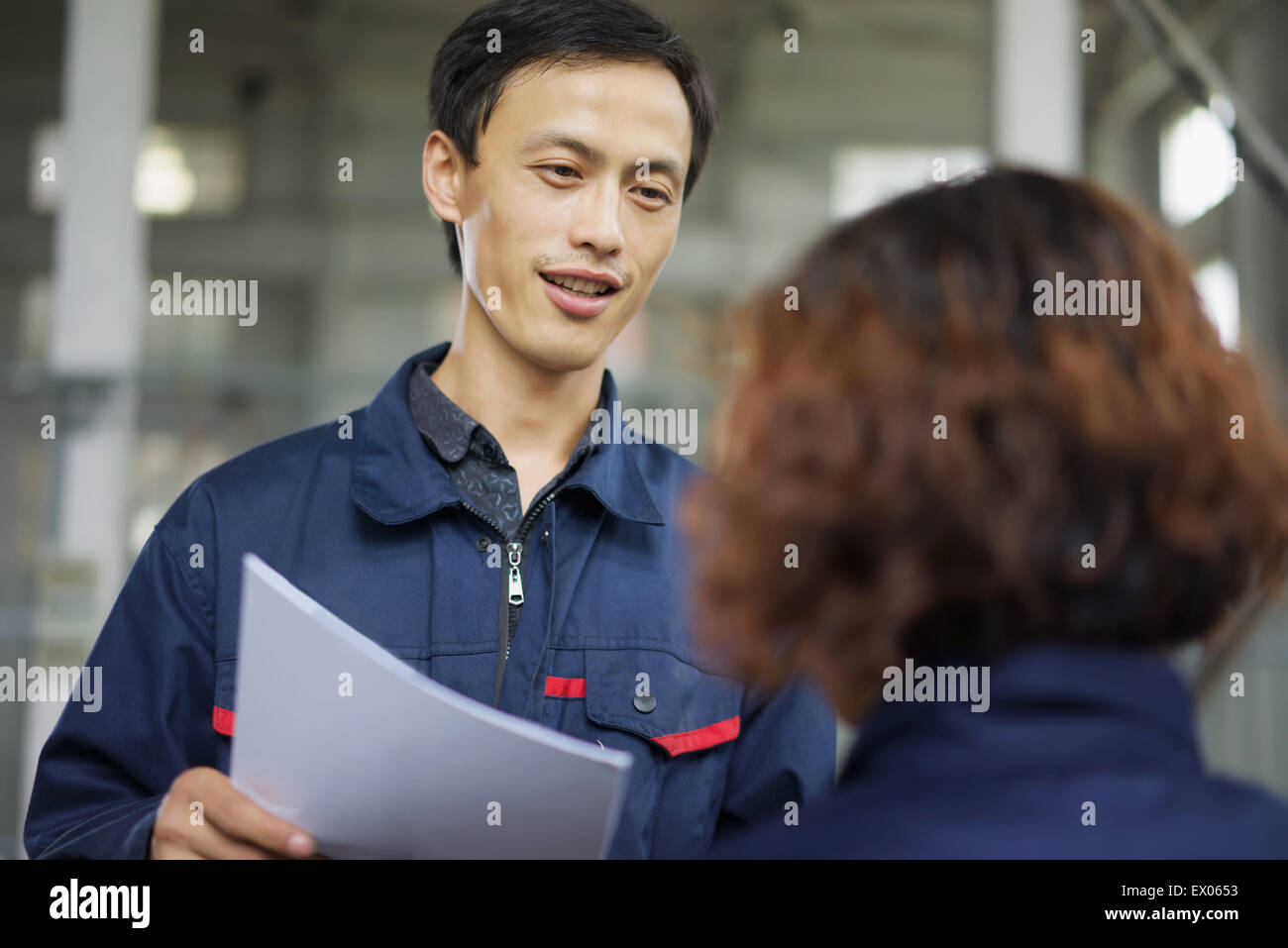Two workers having conversation hi-res stock photography and images - Alamy