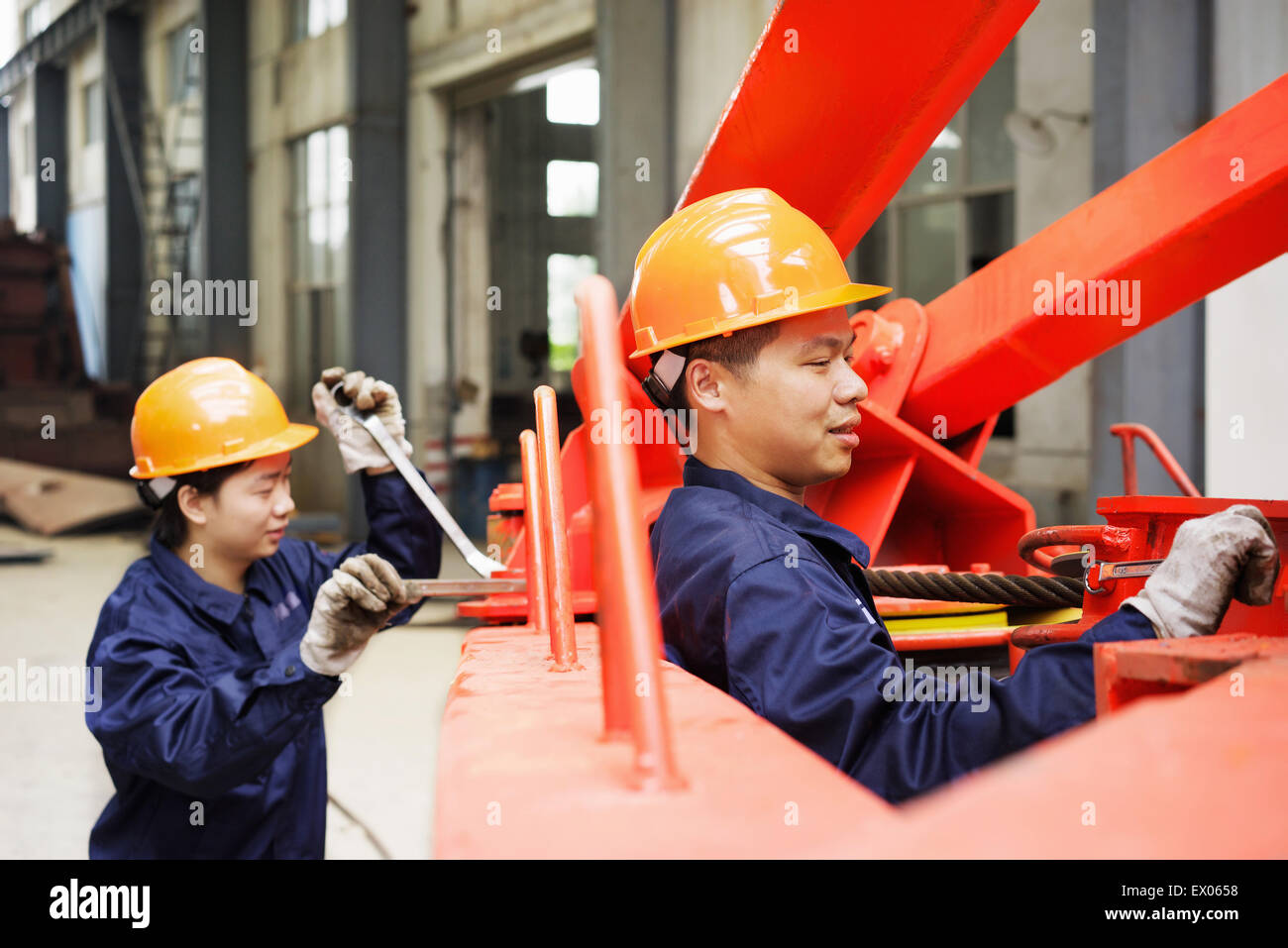 Male workers, chinese factory hi-res stock photography and images - Alamy
