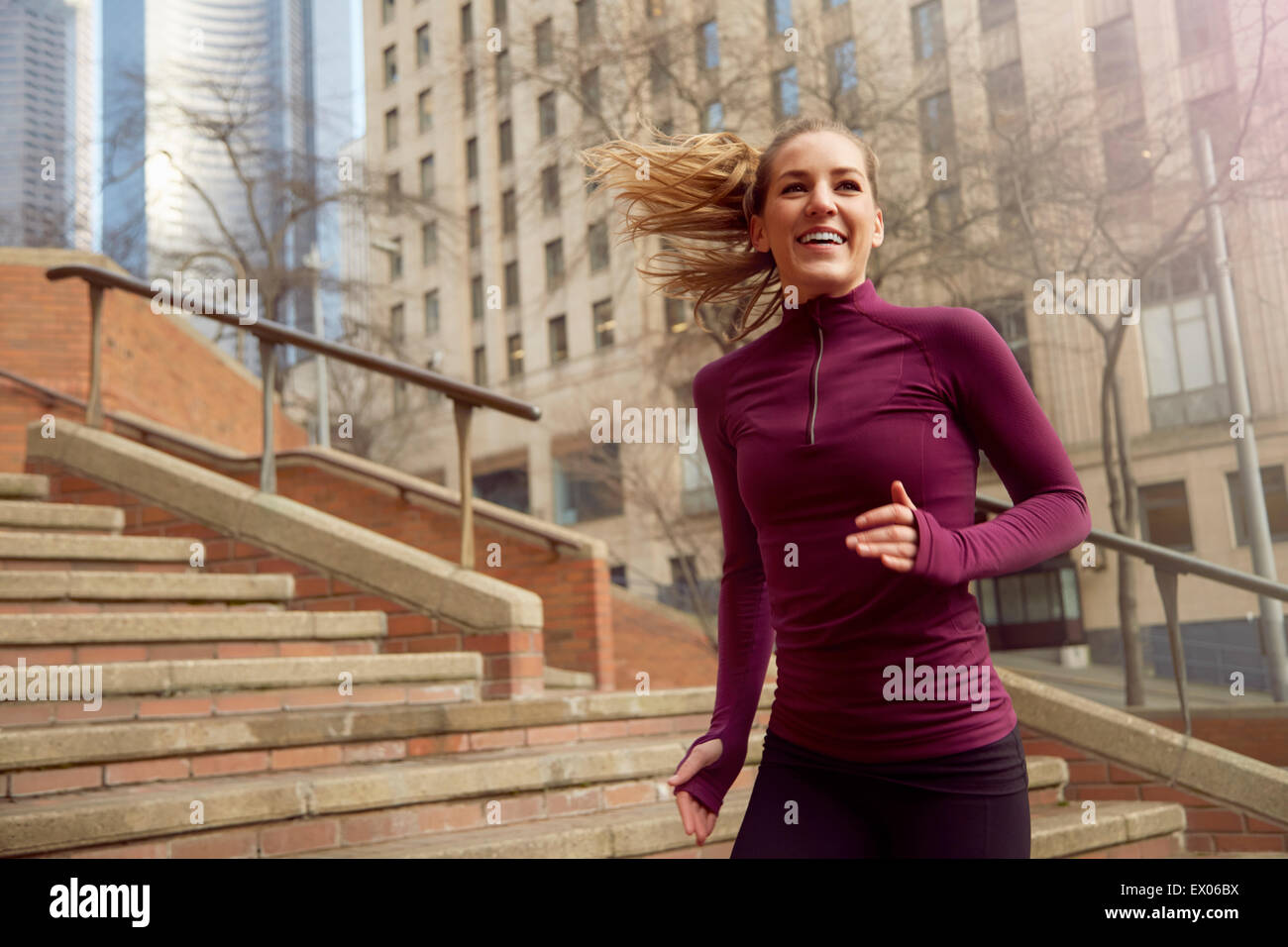 Young woman running along street, Pioneer Square, Seattle, USA Stock ...