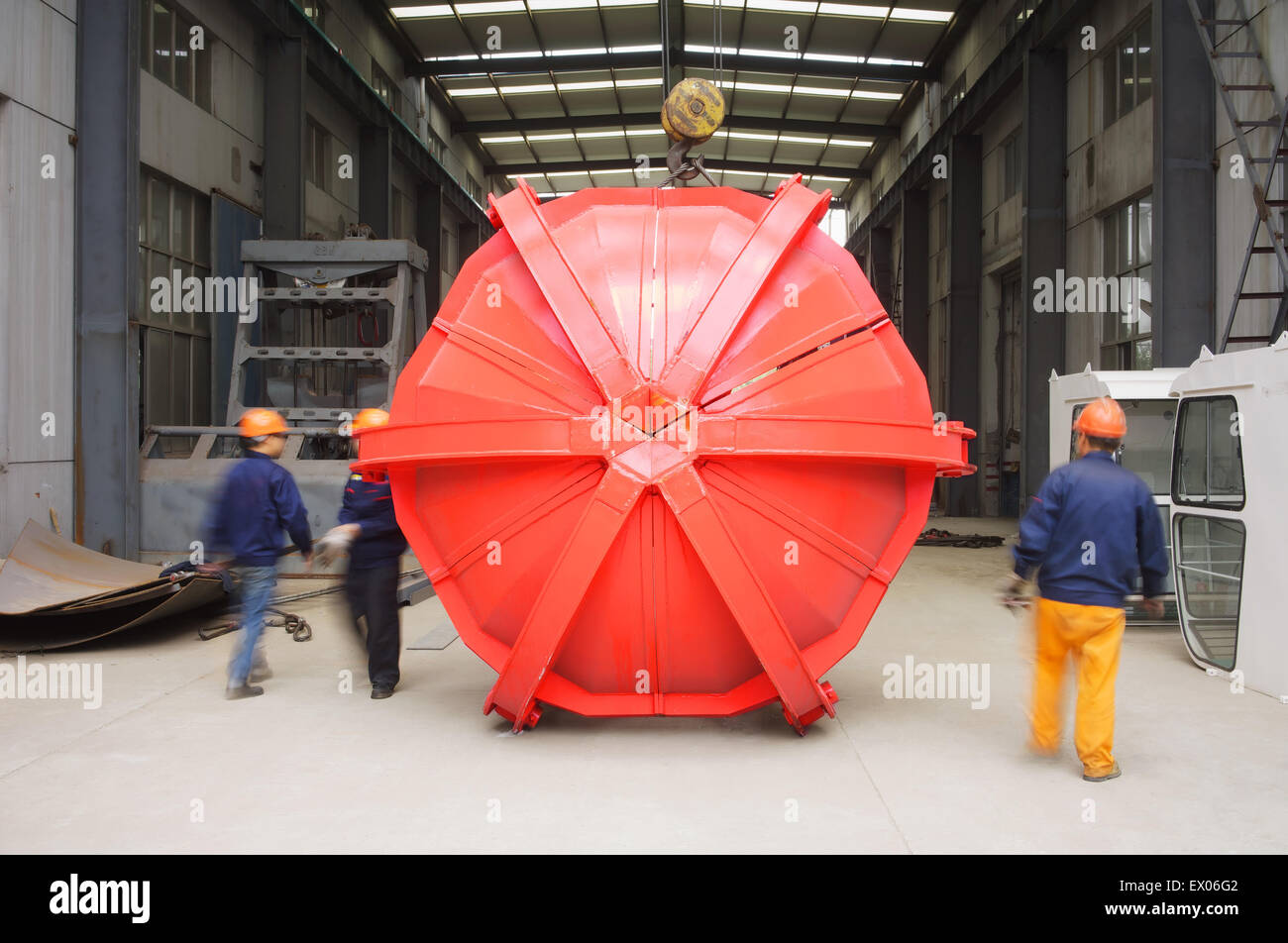 Small group of workers in crane manufacturing facility, China Stock ...