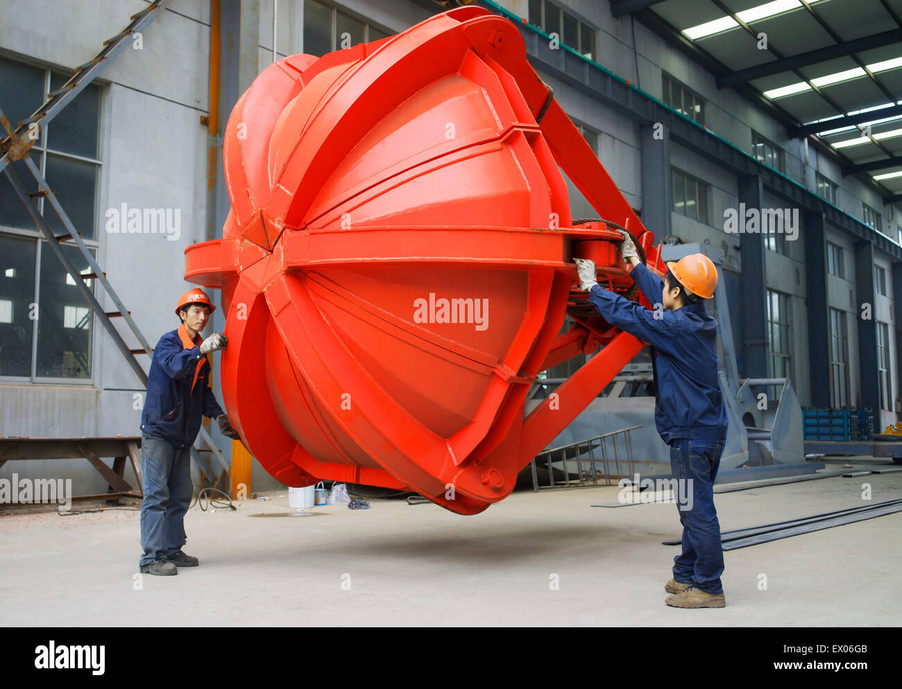 Male workers, chinese factory hi-res stock photography and images - Alamy