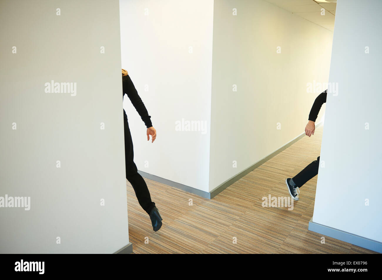 People walking across corridor Stock Photo - Alamy