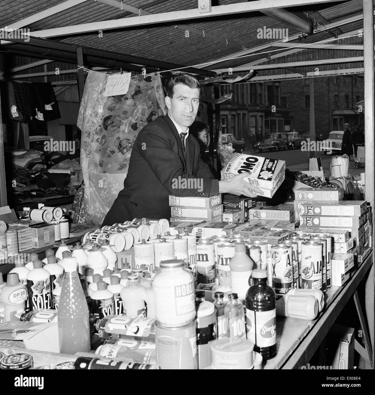 Blackburn Rovers footballer Bryan Douglas serving on his stall at the ...