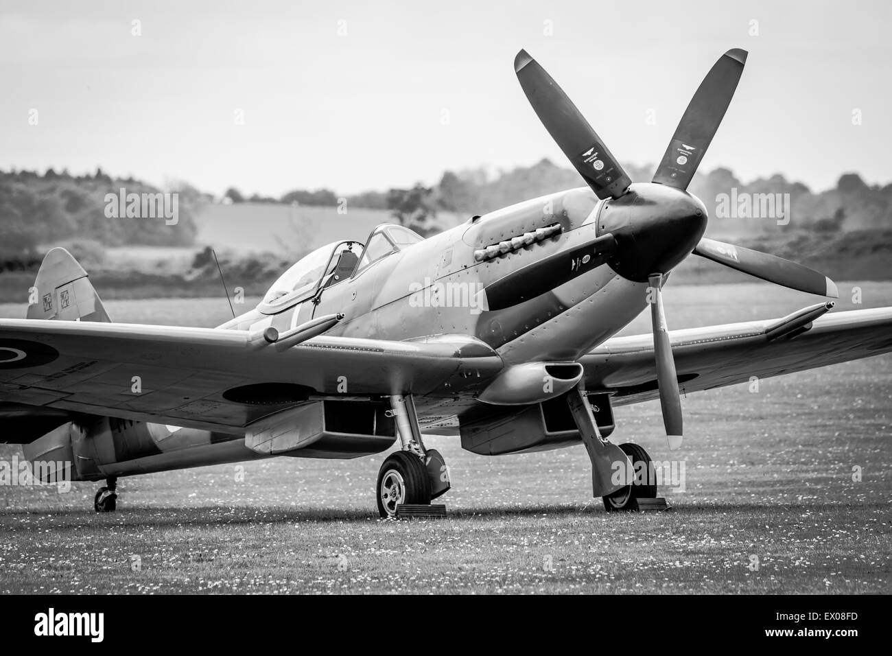 Spitfire stands ready on airfield, black and white Stock Photo - Alamy