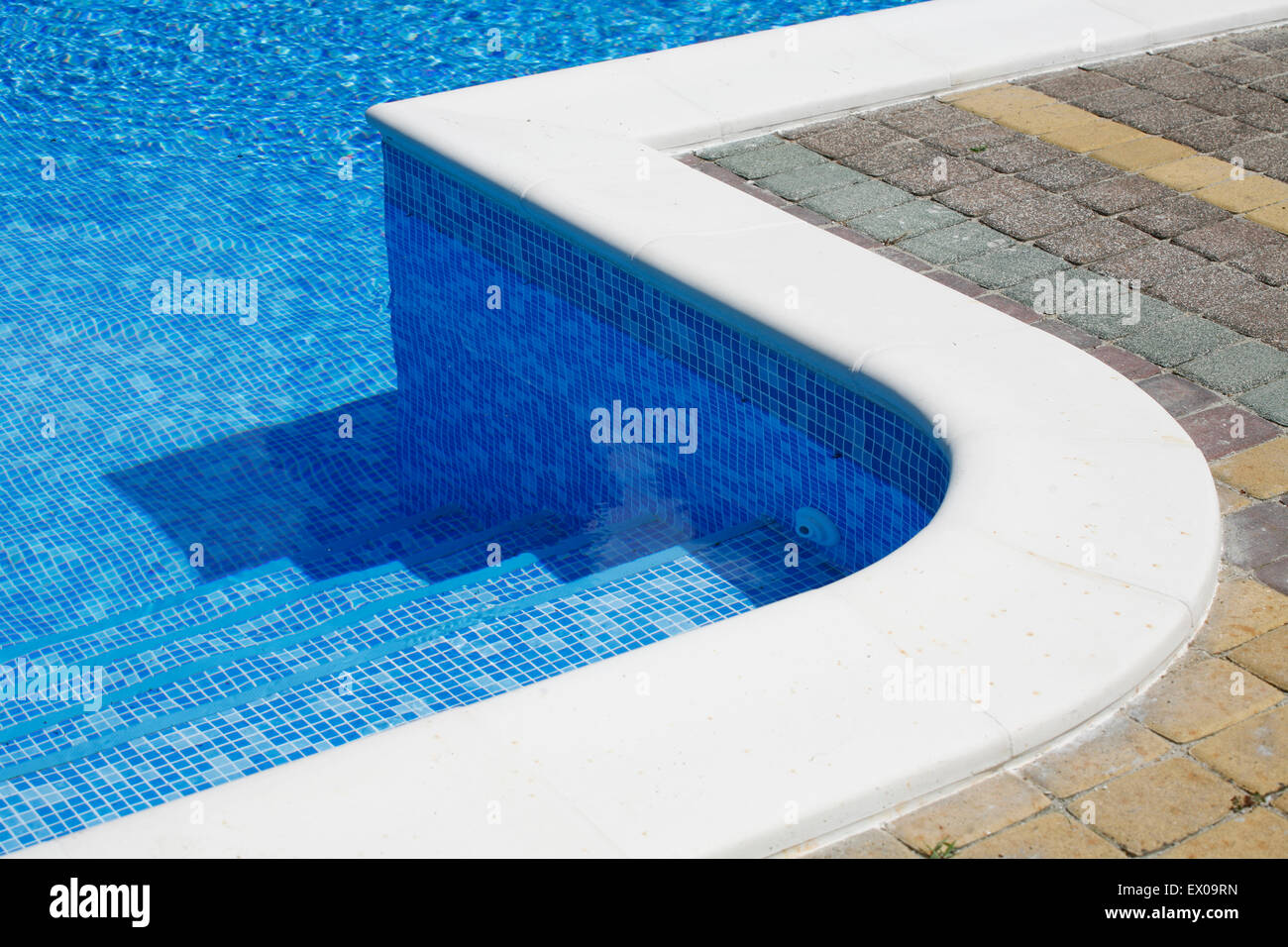 Swimming pool with transparent clear water and stairs Stock Photo - Alamy