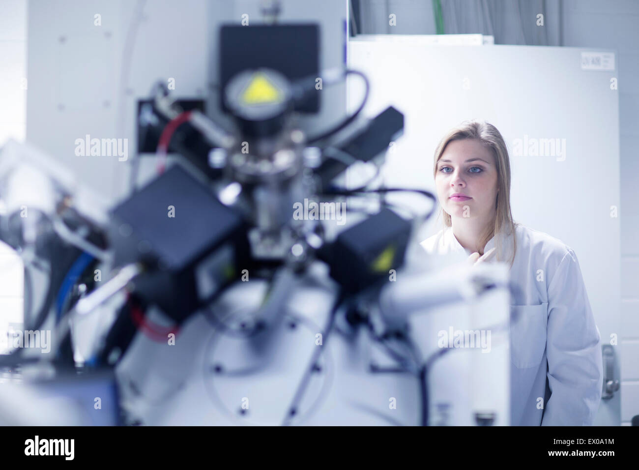 Female scientist using scanning electron microscope in lab Stock Photo ...