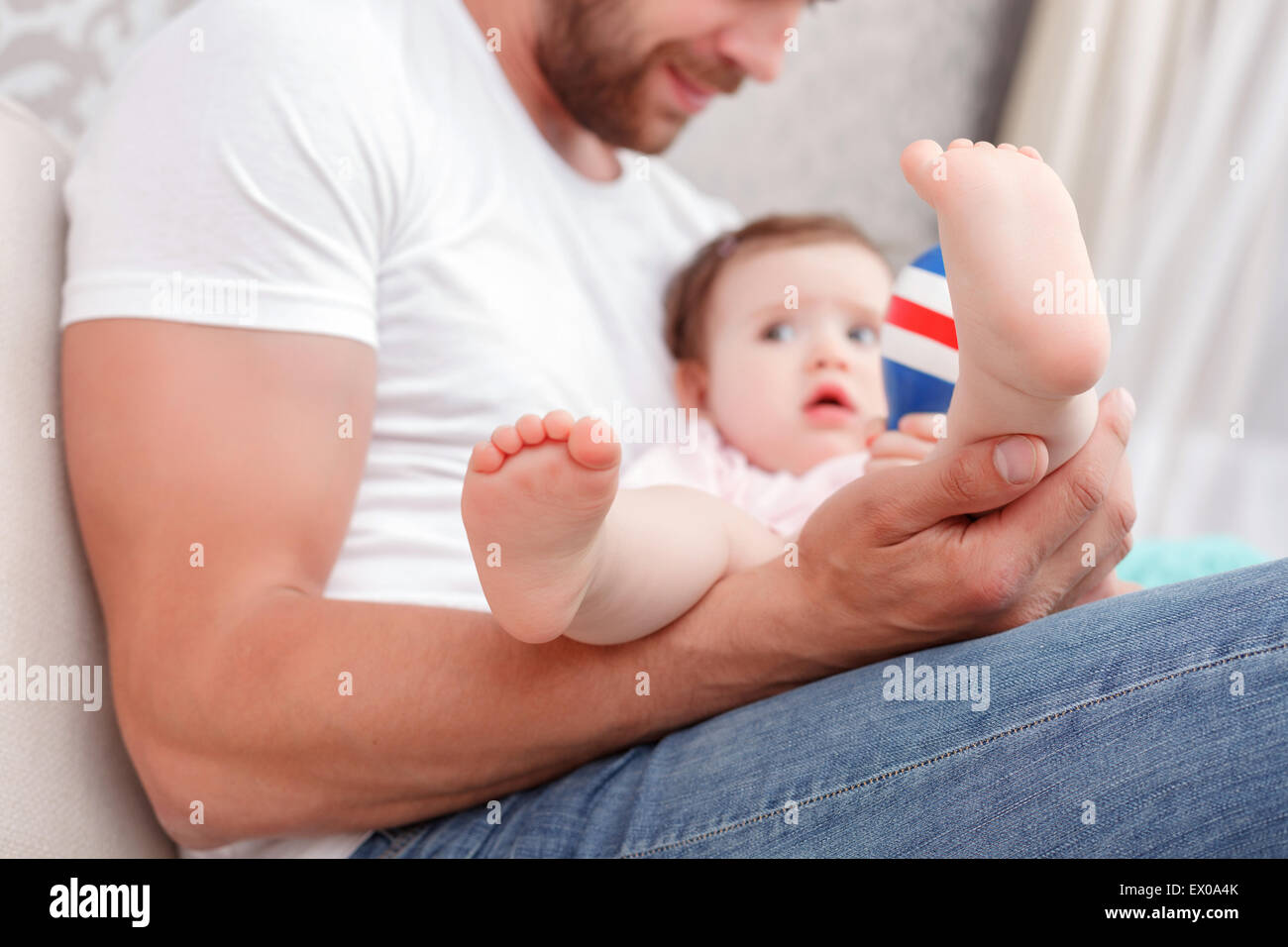 Loving father holding baby Stock Photo - Alamy