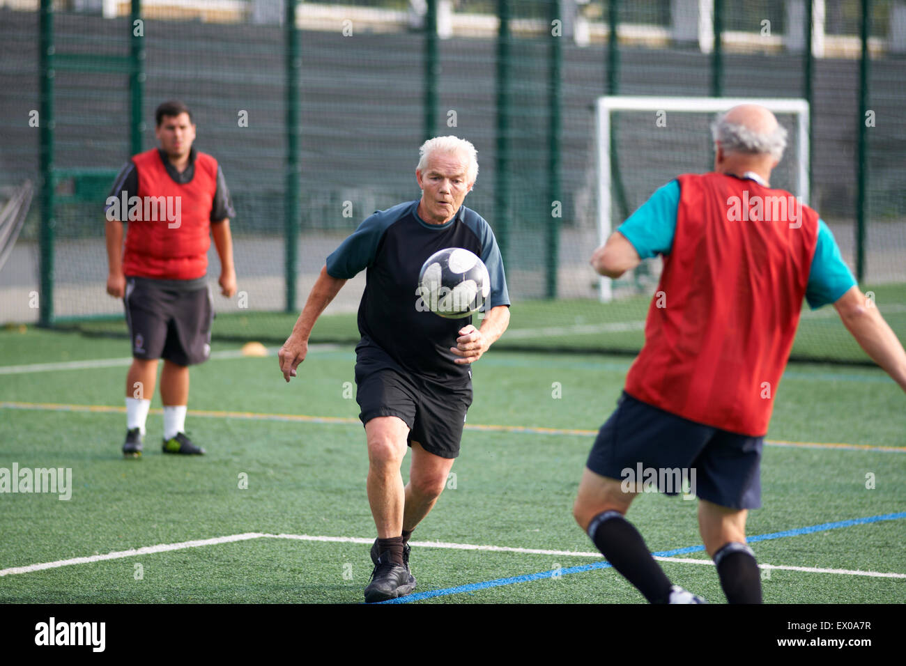 Men Playing Football High Resolution Stock Photography and Images - Alamy