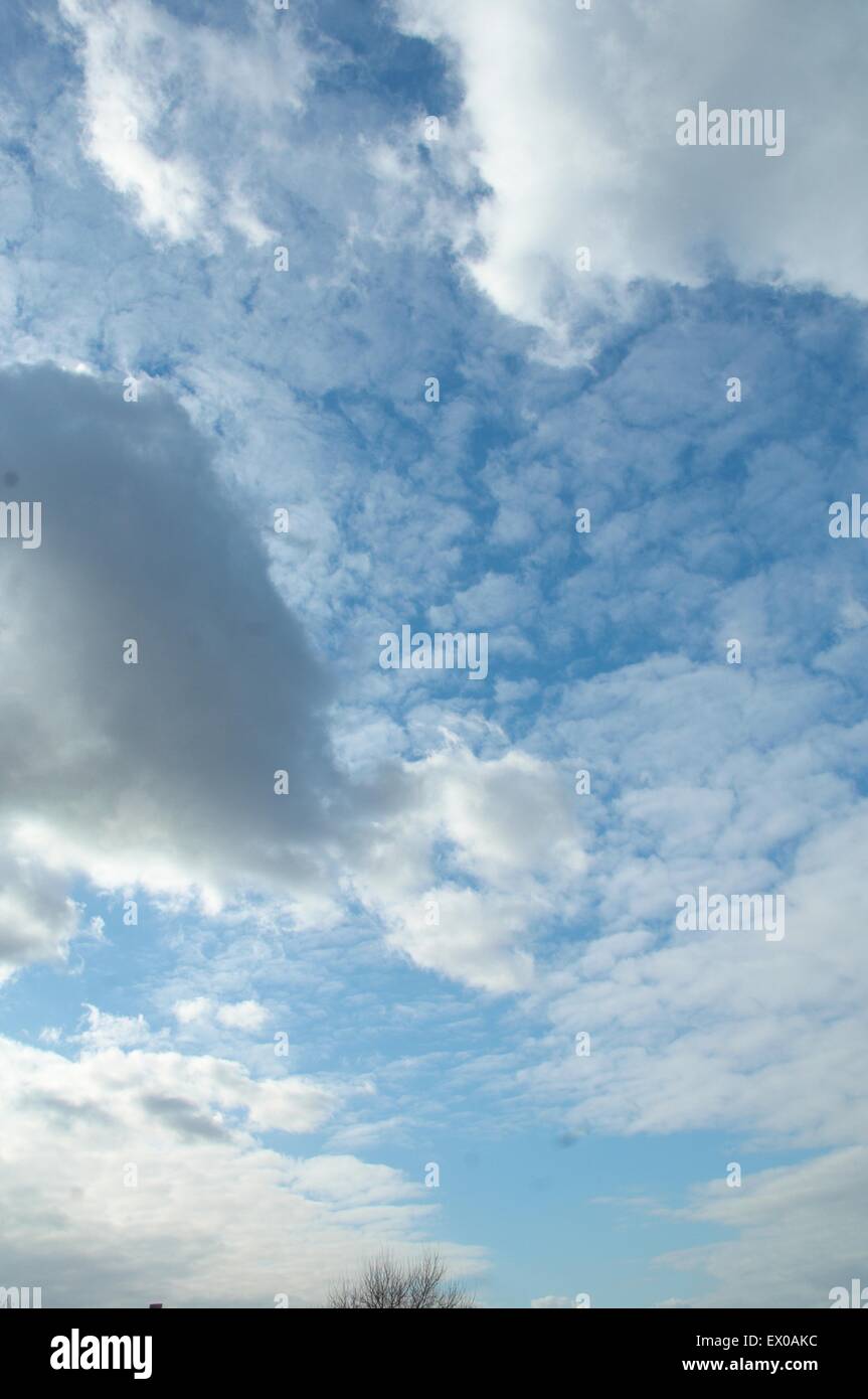 Fluffy rolling and floating clouds Stock Photo - Alamy
