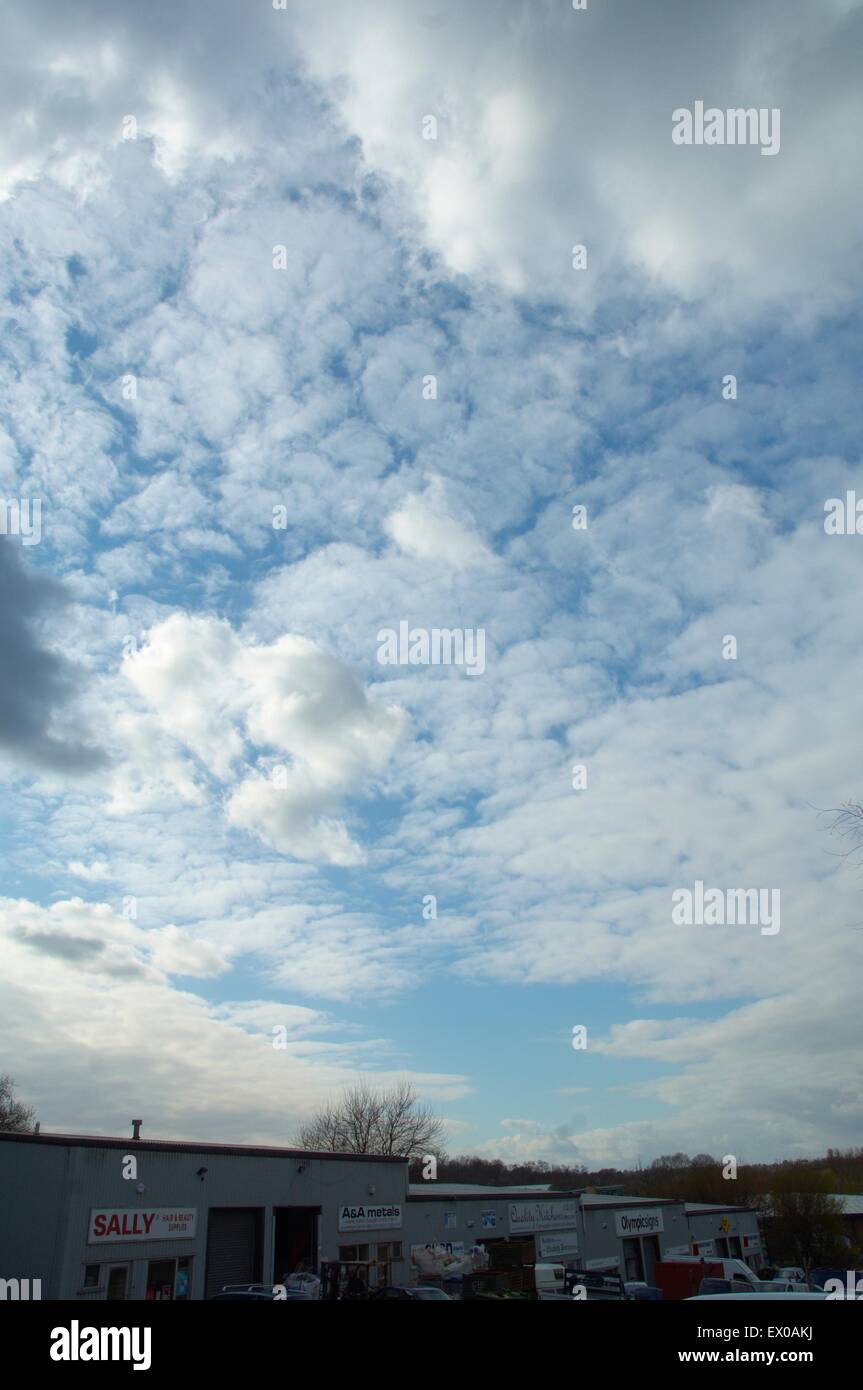 Industrial units with fluffy clouds overhead Stock Photo - Alamy
