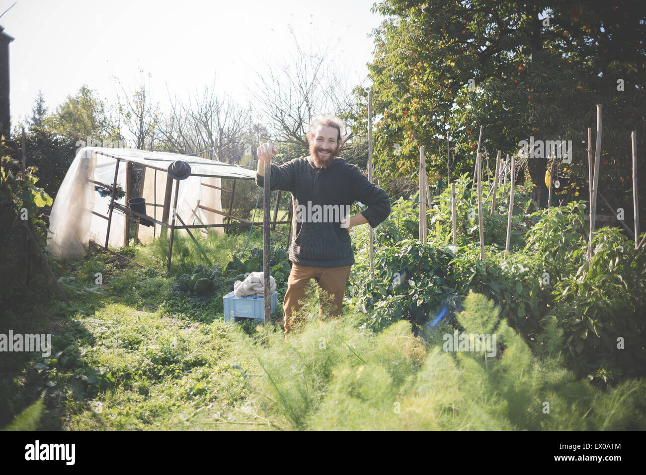 Young man in garden, portrait Stock Photo - Alamy