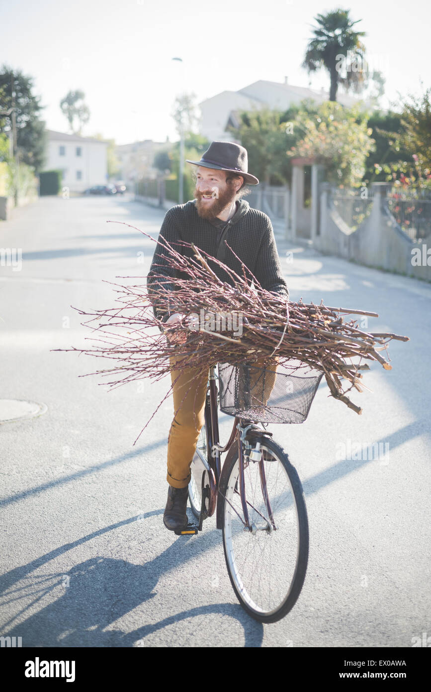 Man carrying wood on bicycle hi-res stock photography and images - Alamy