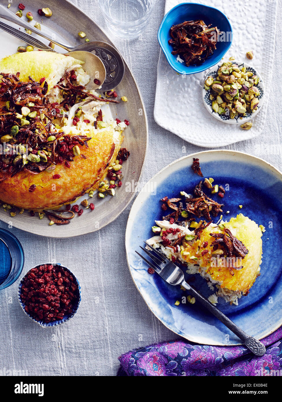 Still life of Iranian tahchin with rice, chicken and yogurt Stock Photo ...