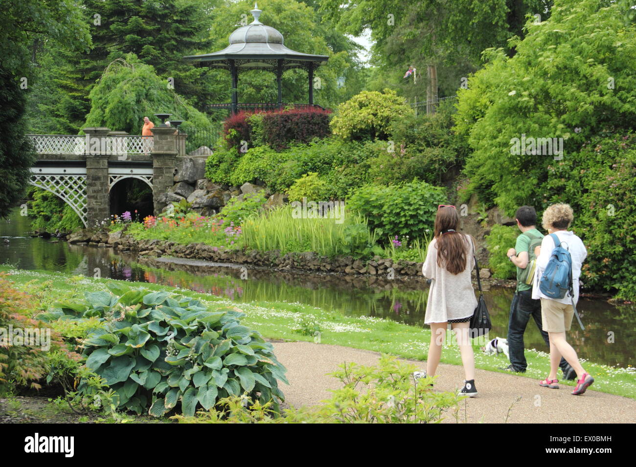 People walk by the River Wye as it passes near the bandstand (pictured ...