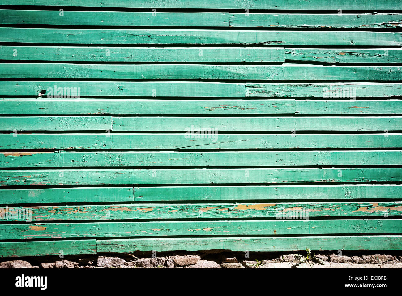 Peeling green paint on weathered wood wall Stock Photo - Alamy