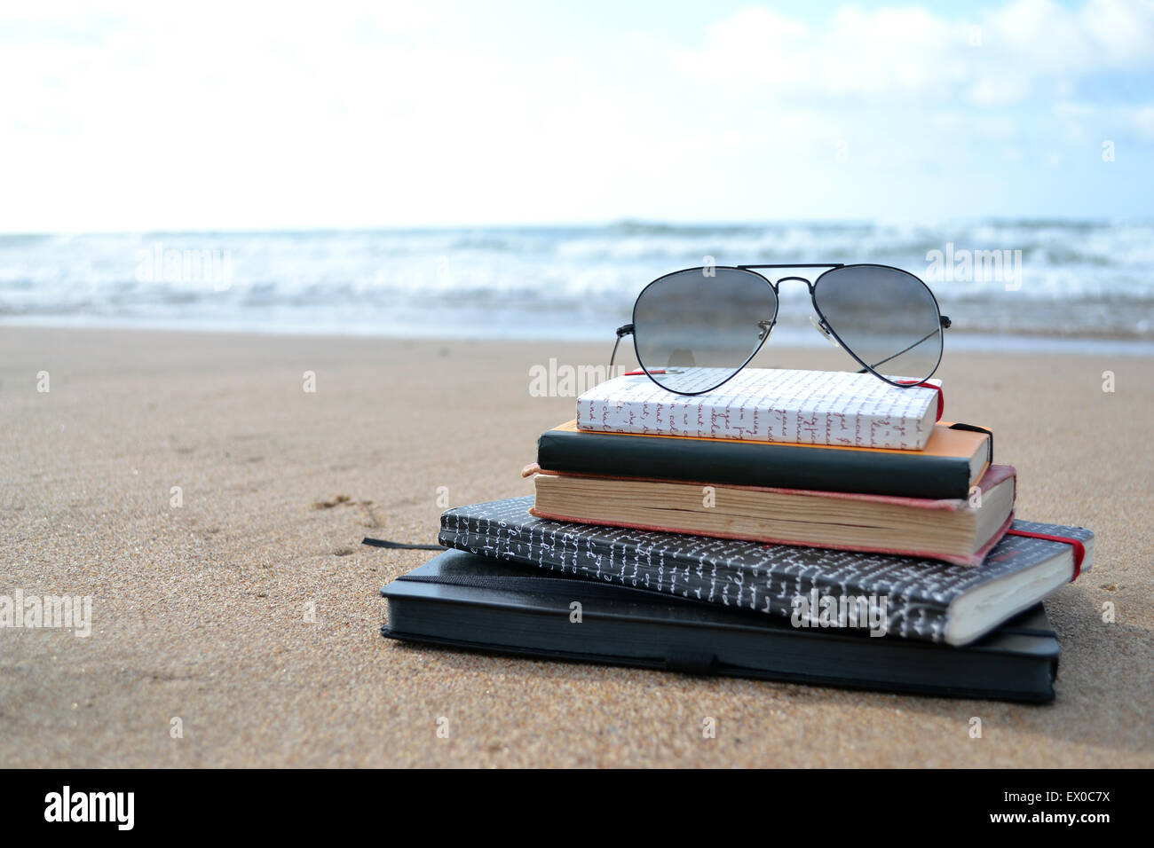 Books on a beach Stock Photo - Alamy