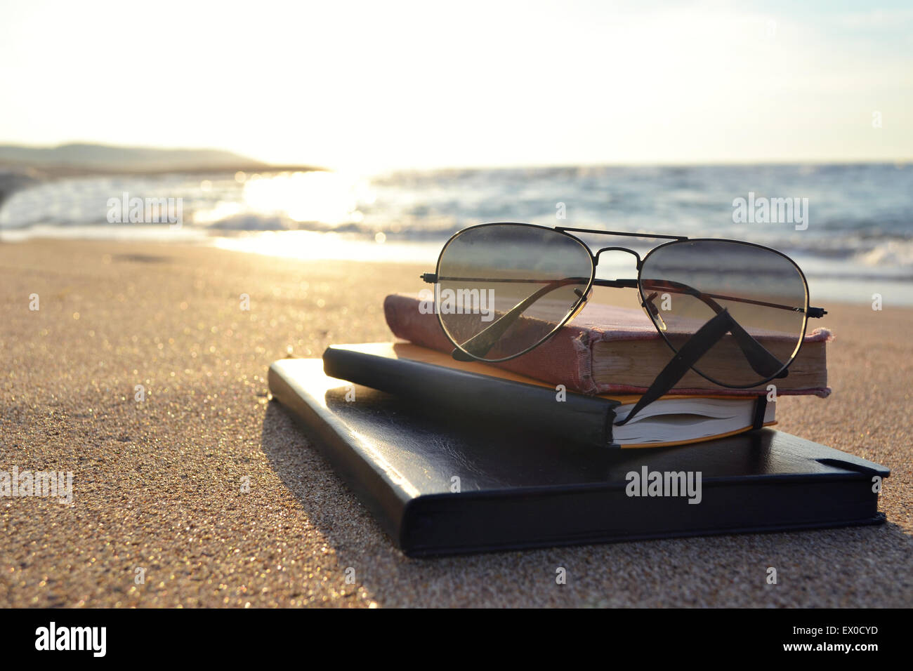 Books on a beach Stock Photo - Alamy
