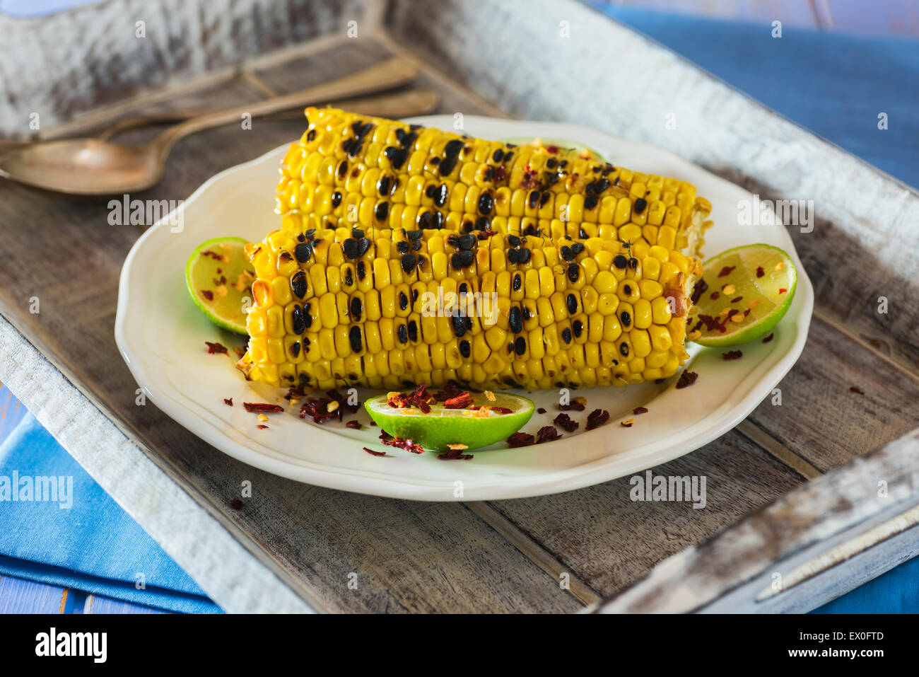 Grilled sweetcorn with lime and chilli flakes Stock Photo - Alamy