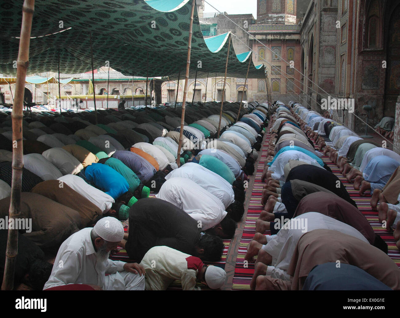 Lahore. 3rd July, 2015. Pakistani Muslims offer Friday prayers at a ...