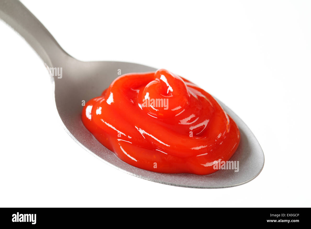 Tomato sauce on a spoon Stock Photo - Alamy