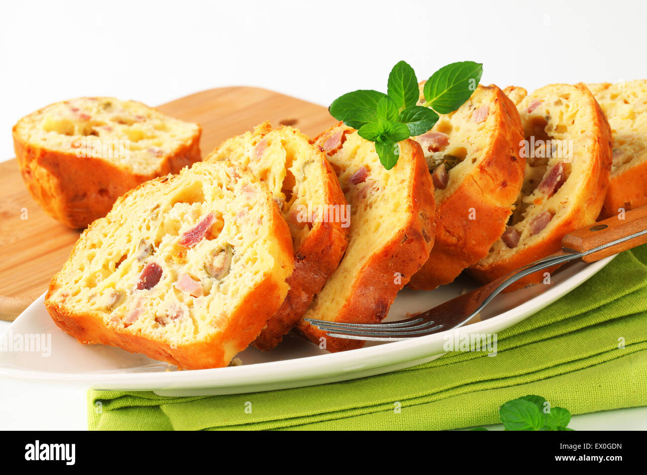 Slices of savory ham and olive cake Stock Photo - Alamy