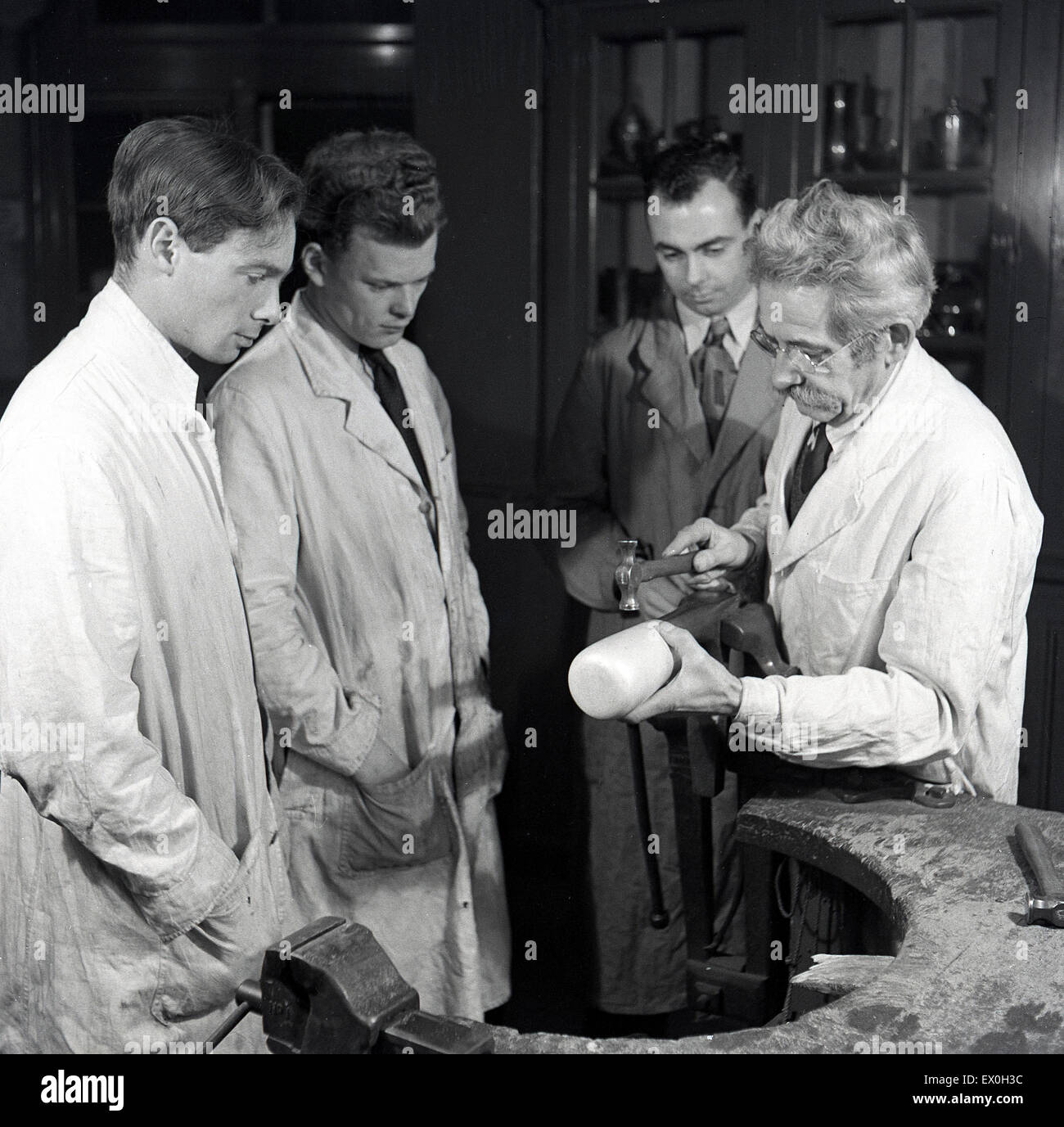 1950s historical, three male engineering apprentices or students in ...