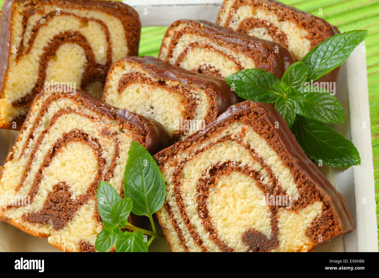Slices of marble cake with chocolate icing Stock Photo - Alamy