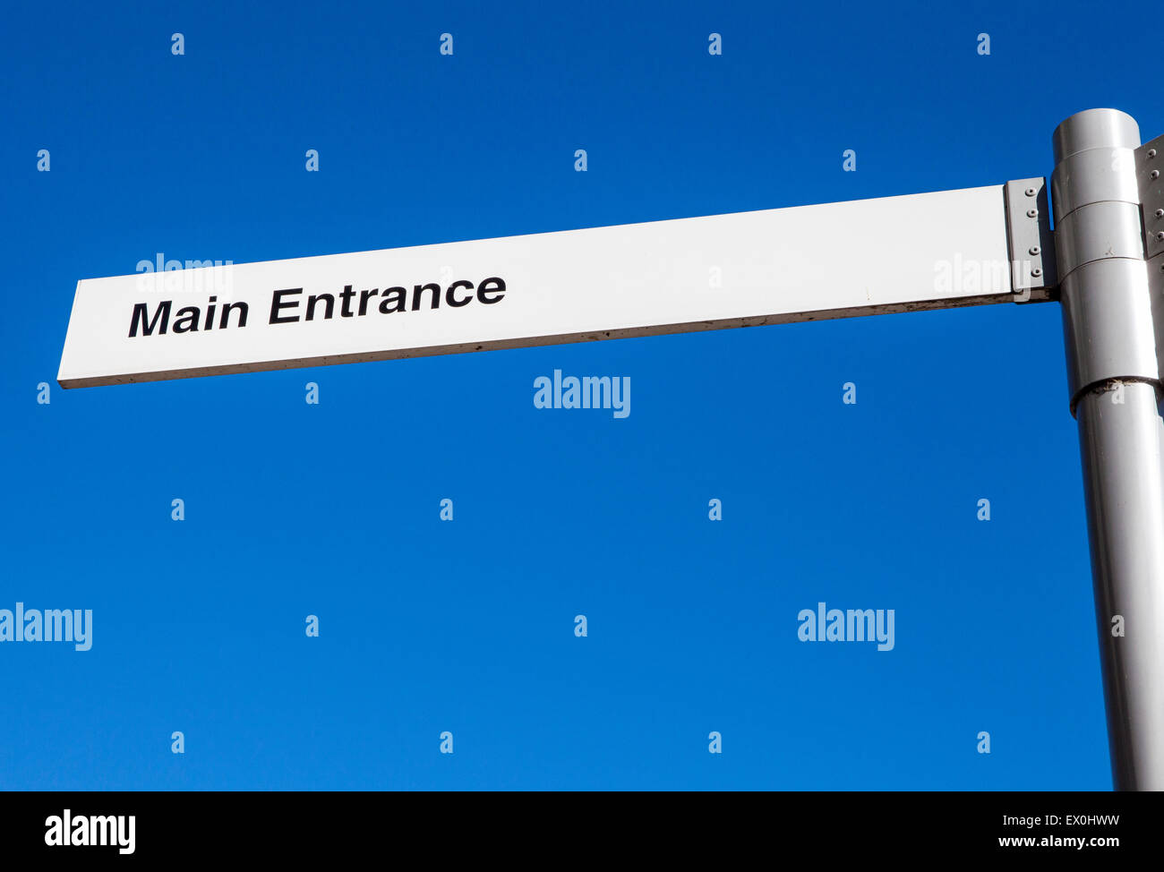 A sign indicating the direction of the Main Entrance Stock Photo - Alamy