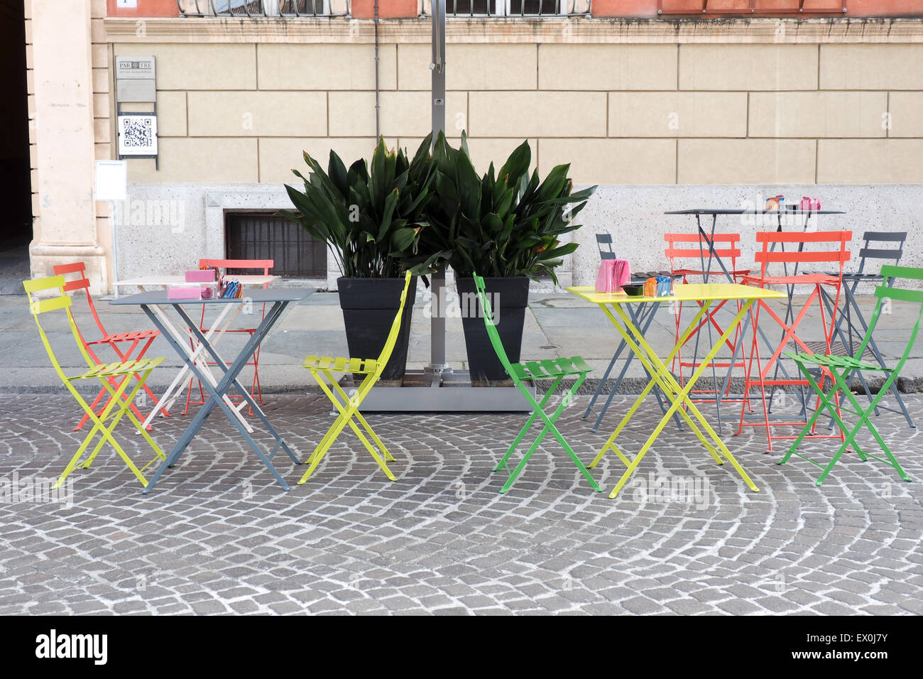 Colourful outdoor tables and chairs Stock Photo - Alamy