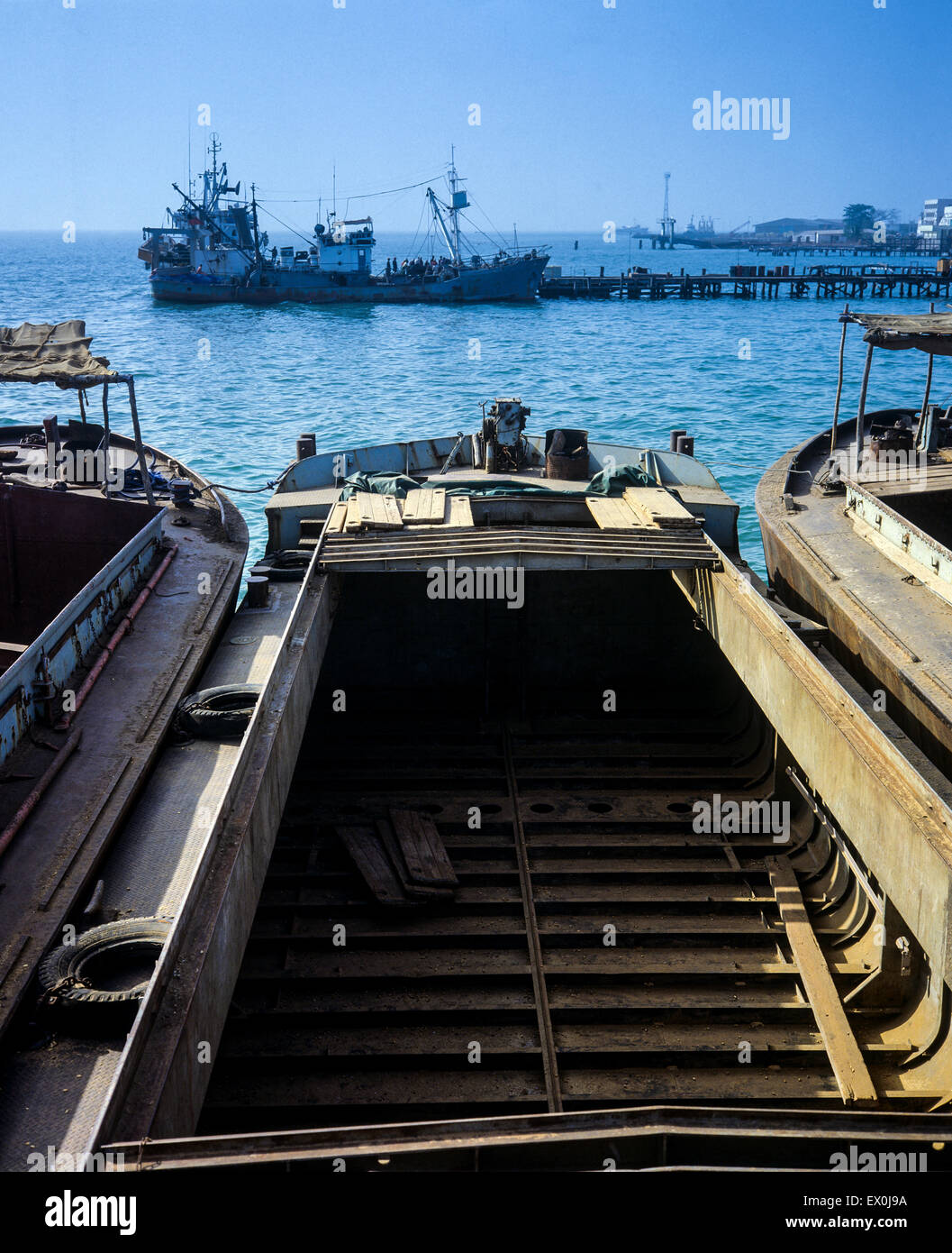 Empty barge and trawler boat moored at pier, Banjul harbour, Gambia ...