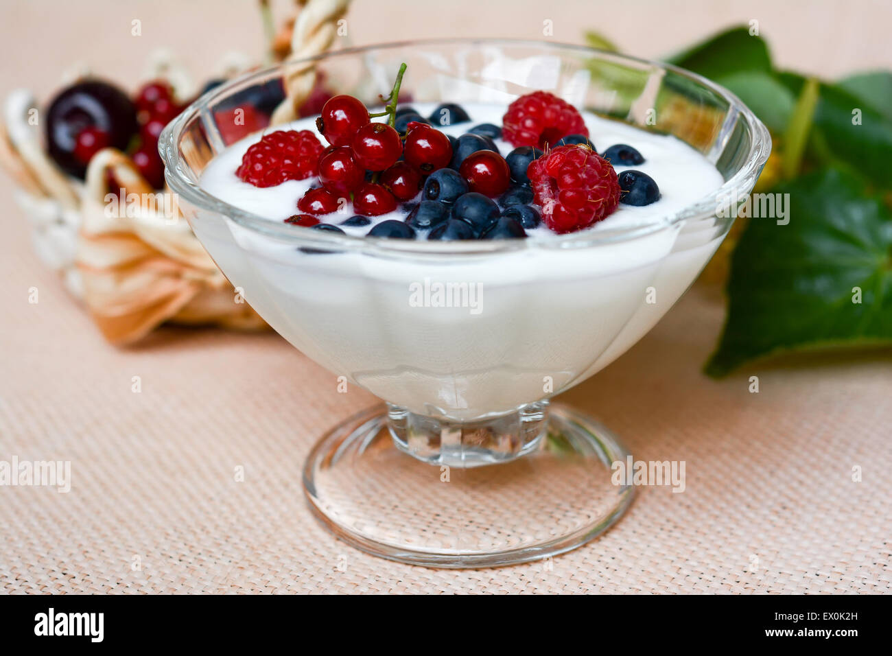 Yogurt with berries in glass bowl Stock Photo - Alamy