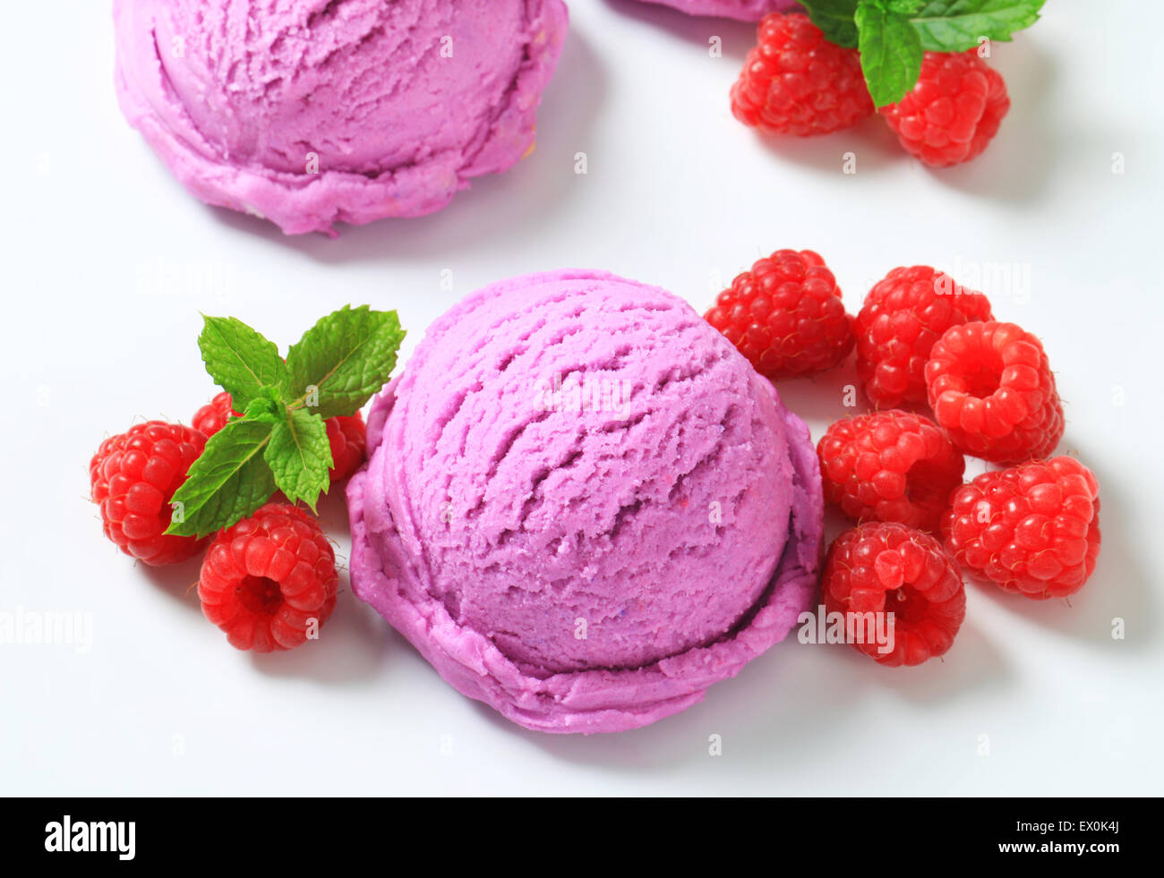 Scoops of purple ice cream and fresh raspberries Stock Photo - Alamy