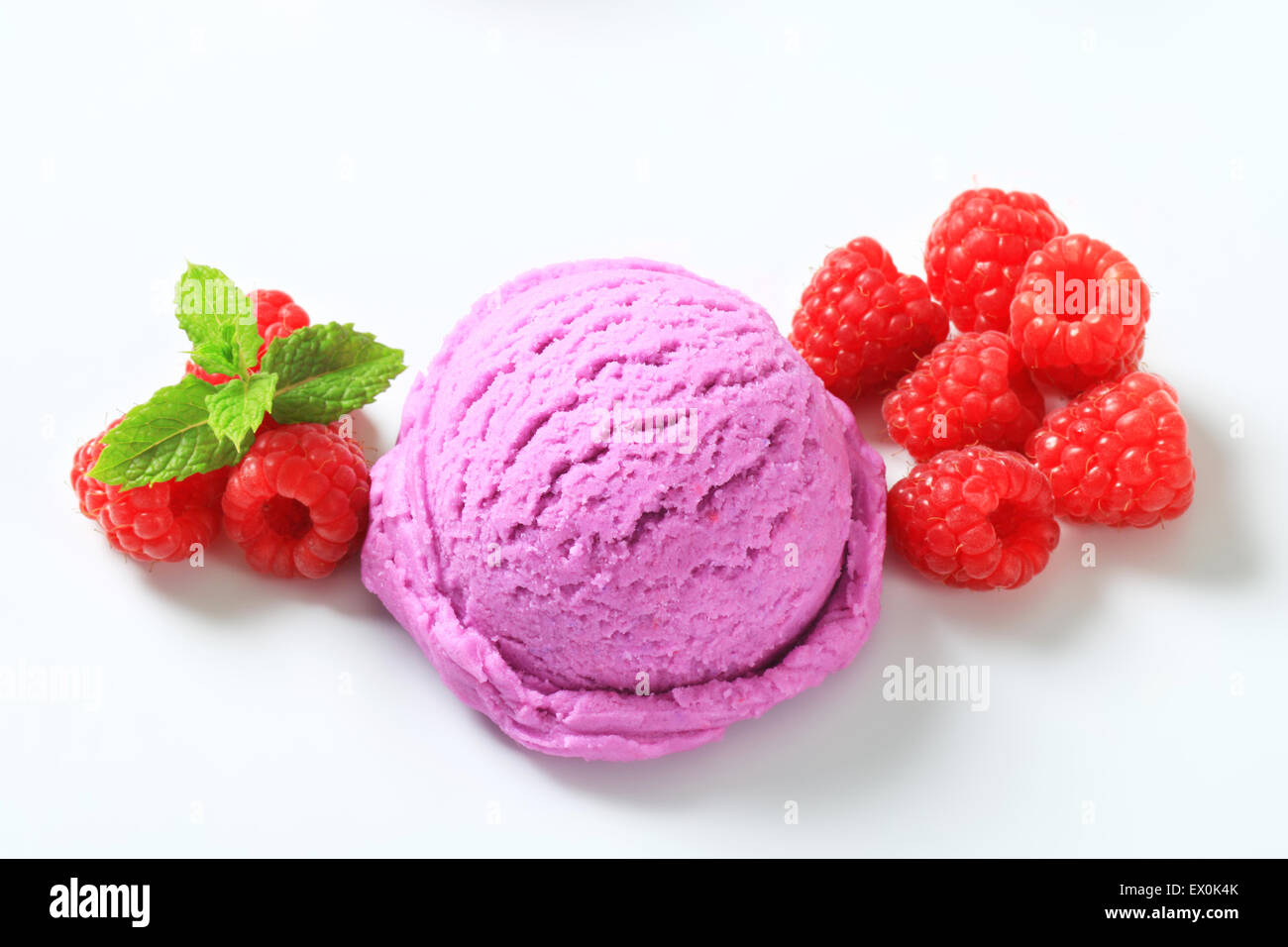 Scoop of berry ice cream with fresh raspberries Stock Photo - Alamy