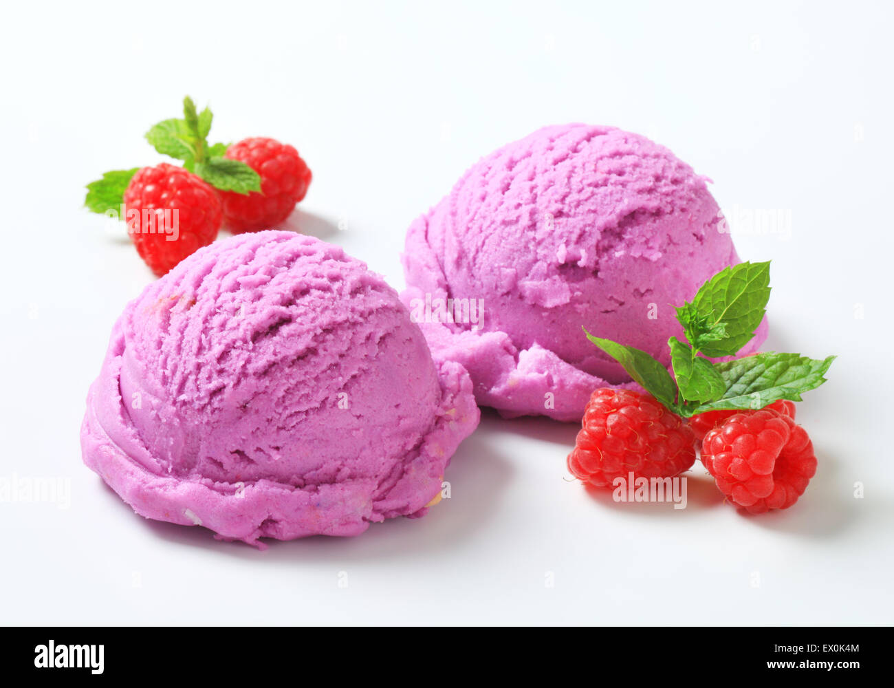 Scoops of purple ice cream and fresh raspberries Stock Photo - Alamy