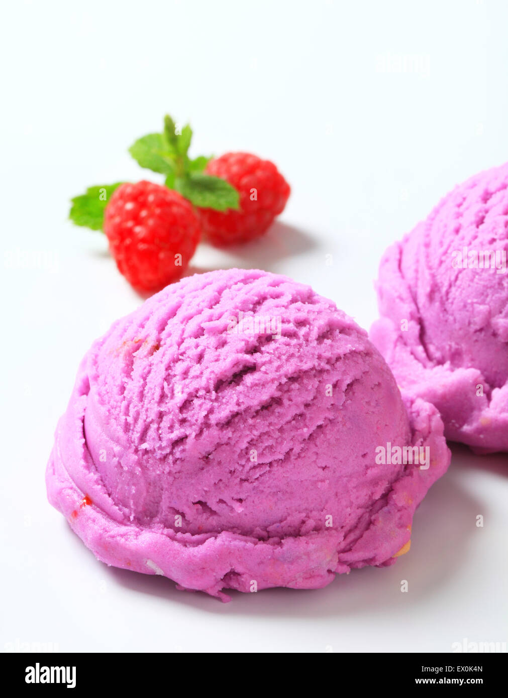 Scoops of purple ice cream and fresh raspberries Stock Photo - Alamy