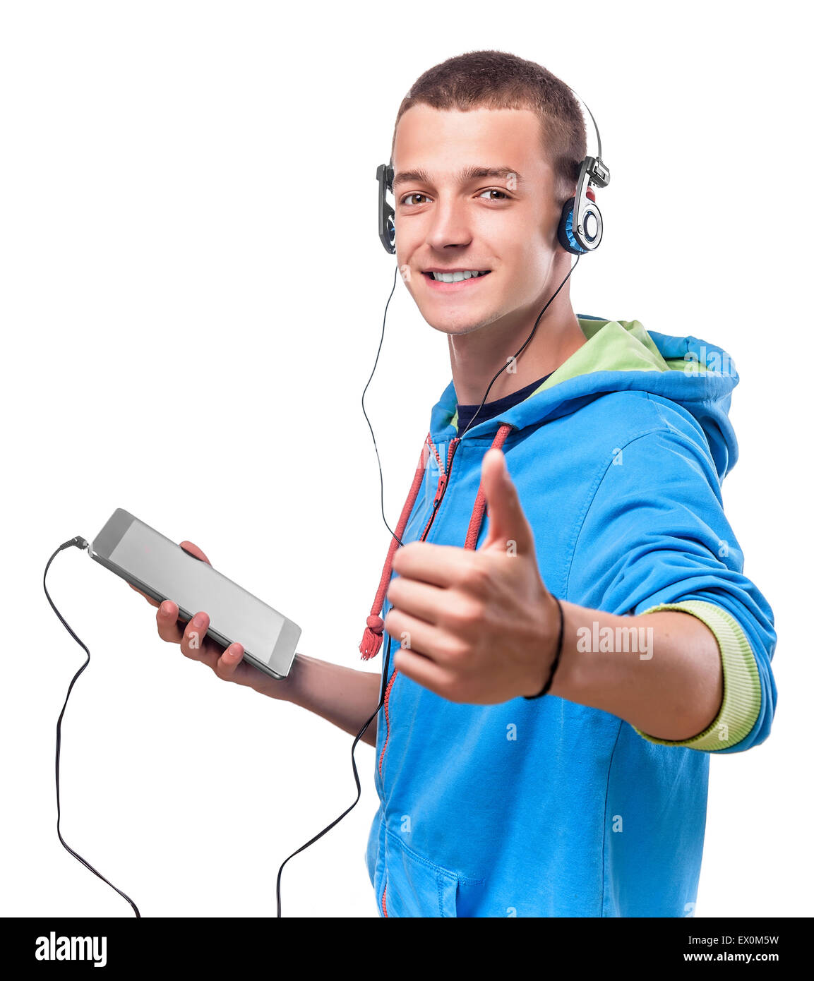 Guy using phone with headphones Stock Photo - Alamy