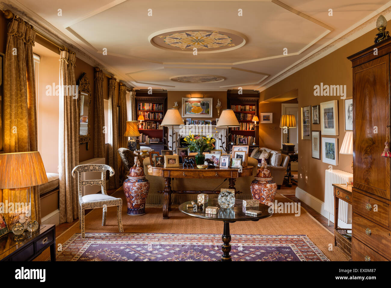 Elegant 1830's elm library table displaying lamps by William Yeoward in ...