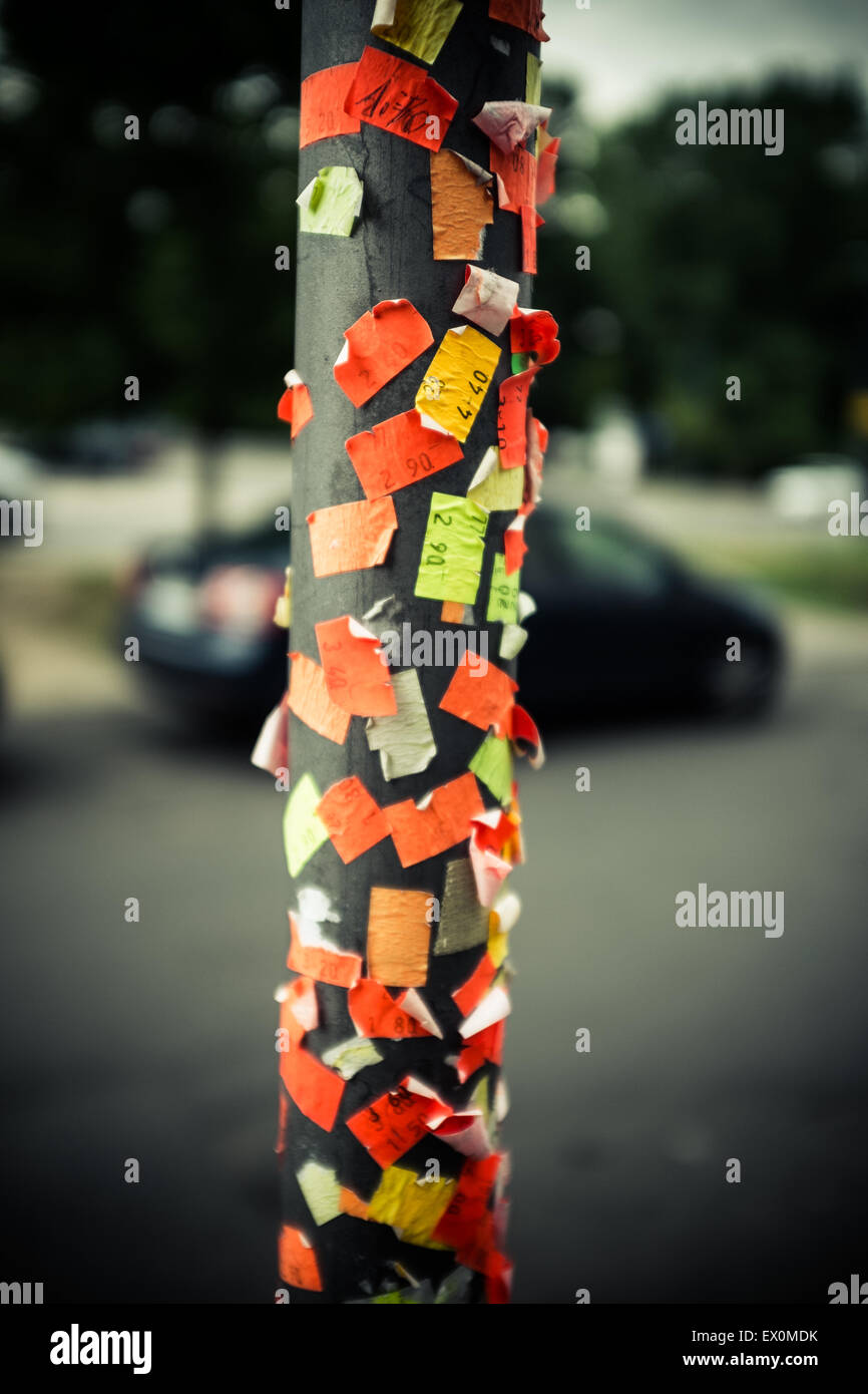 Price stickers on a pole outside a shop in Warsaw Stock Photo - Alamy