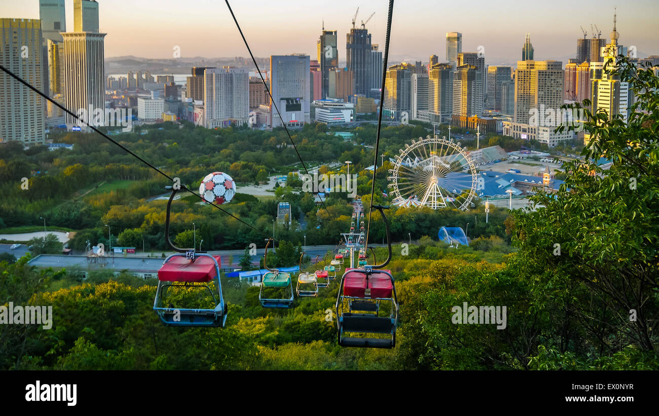 Colorful chairlifts and cityscape of Dalian Stock Photo - Alamy